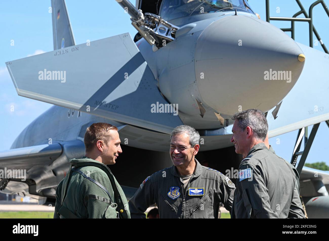 U.S. Air Force Gen. Ken Wilsbach, middle, Pacific Air Forces commander ...