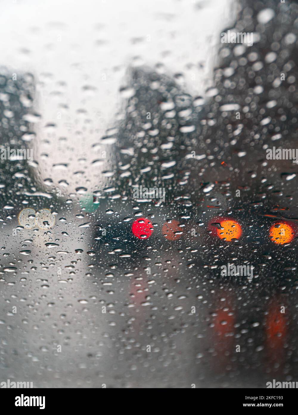 A vertical shot of rain drops on a glass Stock Photo - Alamy