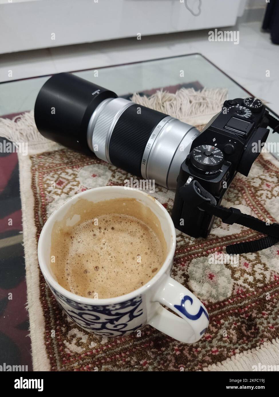 coffee cup and camera on the table Stock Photo - Alamy