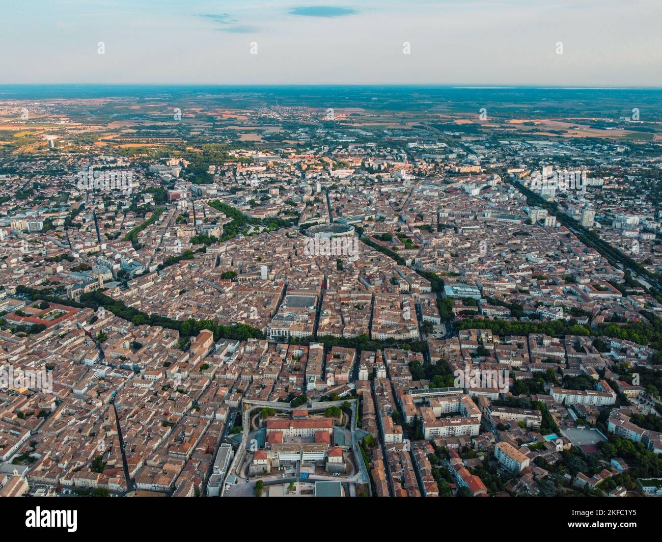 A high angle aerial view of Nimes with beautiful skyline at the horizon ...