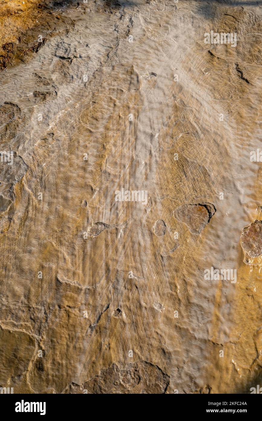 A photograph of flowstone, deposited from calcium carbonate in hot ...
