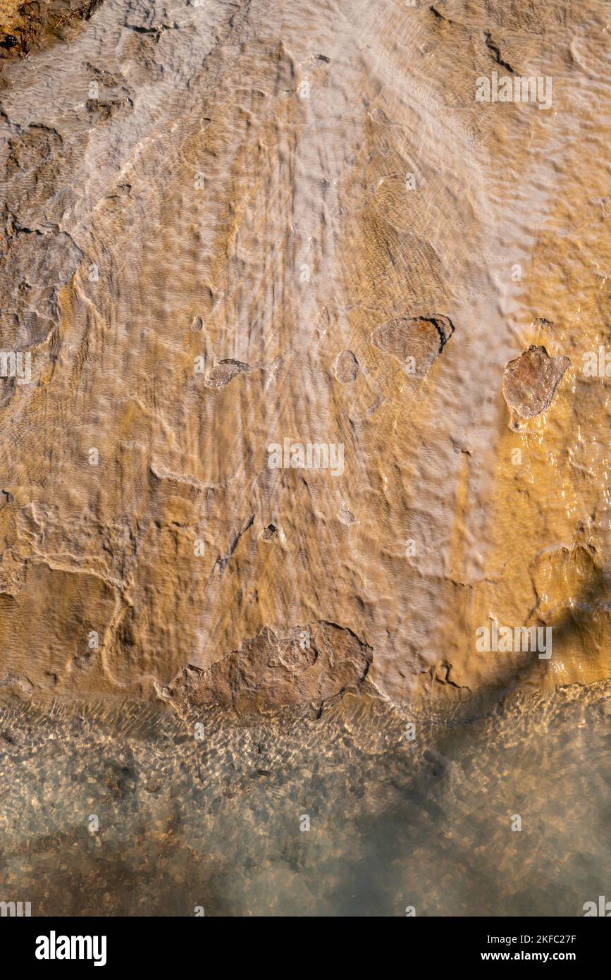 A photograph of flowstone, deposited from calcium carbonate in hot ...