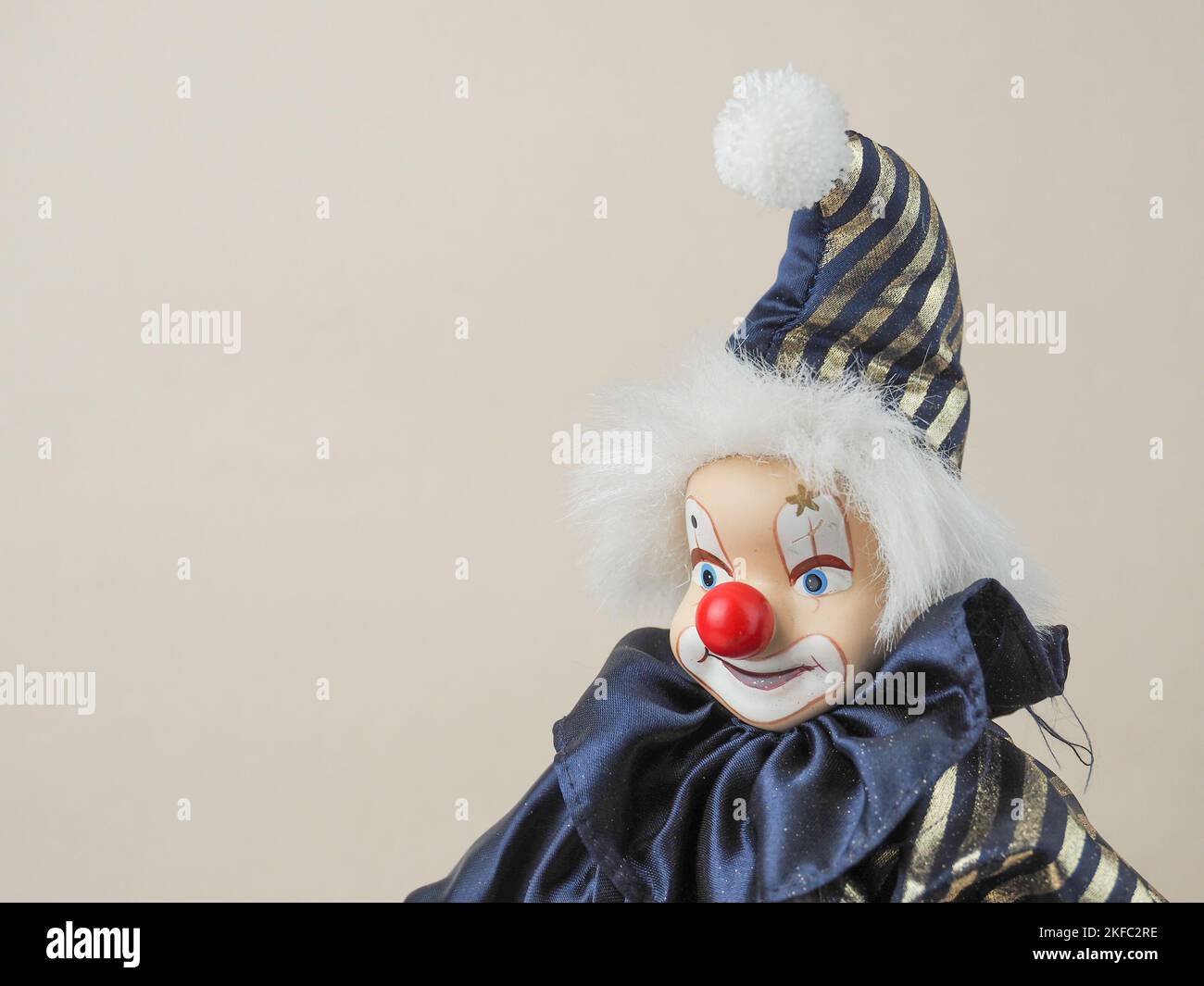 Vintage white clown with red nose doll in a blue suit with cap ...