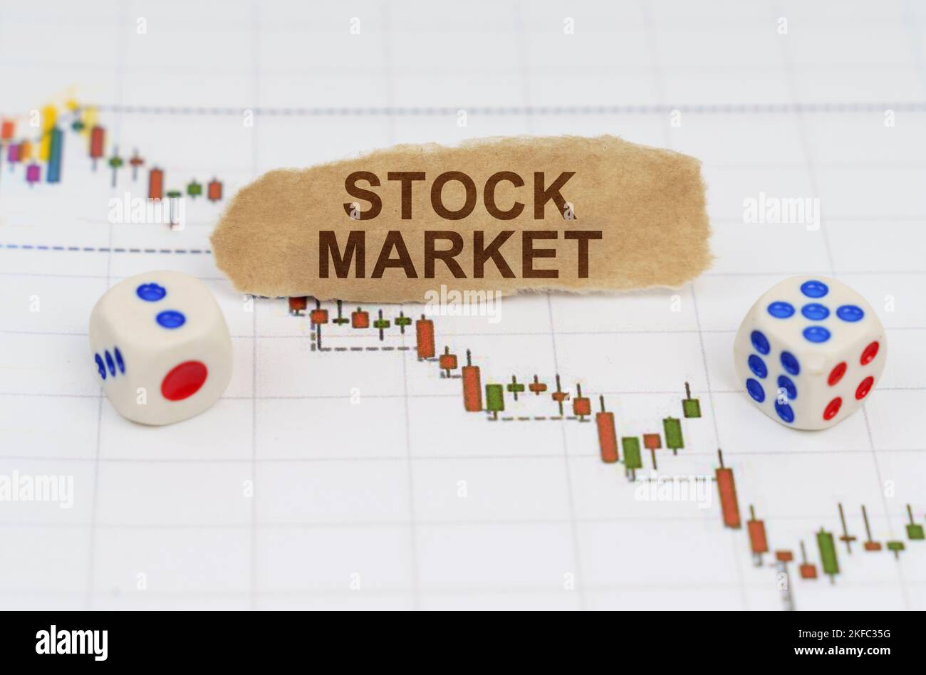 Business and finance concept. On the trading charts, there are dice and ...