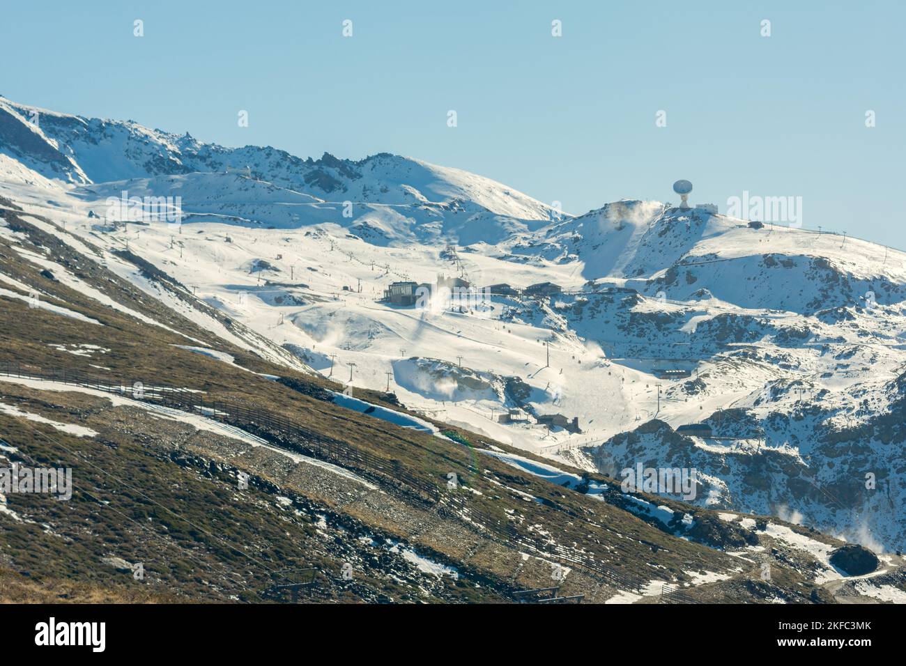 View of the ski resort in the high snowy mountains in winter with clear ...