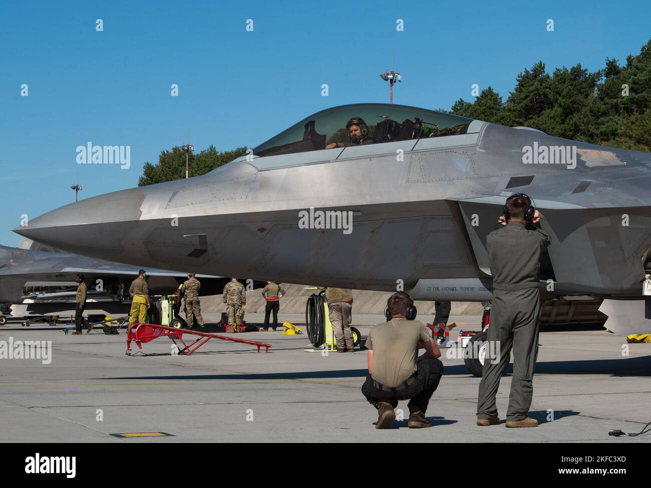 U.S. Air Force Airmen 1st Class Thatcher Deese, left, crew chief, and ...