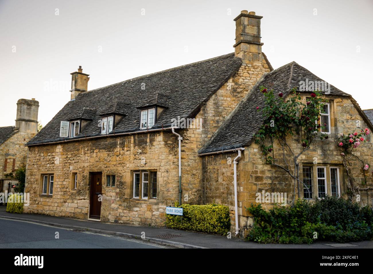 Mullioned windows, diminutive dormers and shingle tile roofed cottage ...