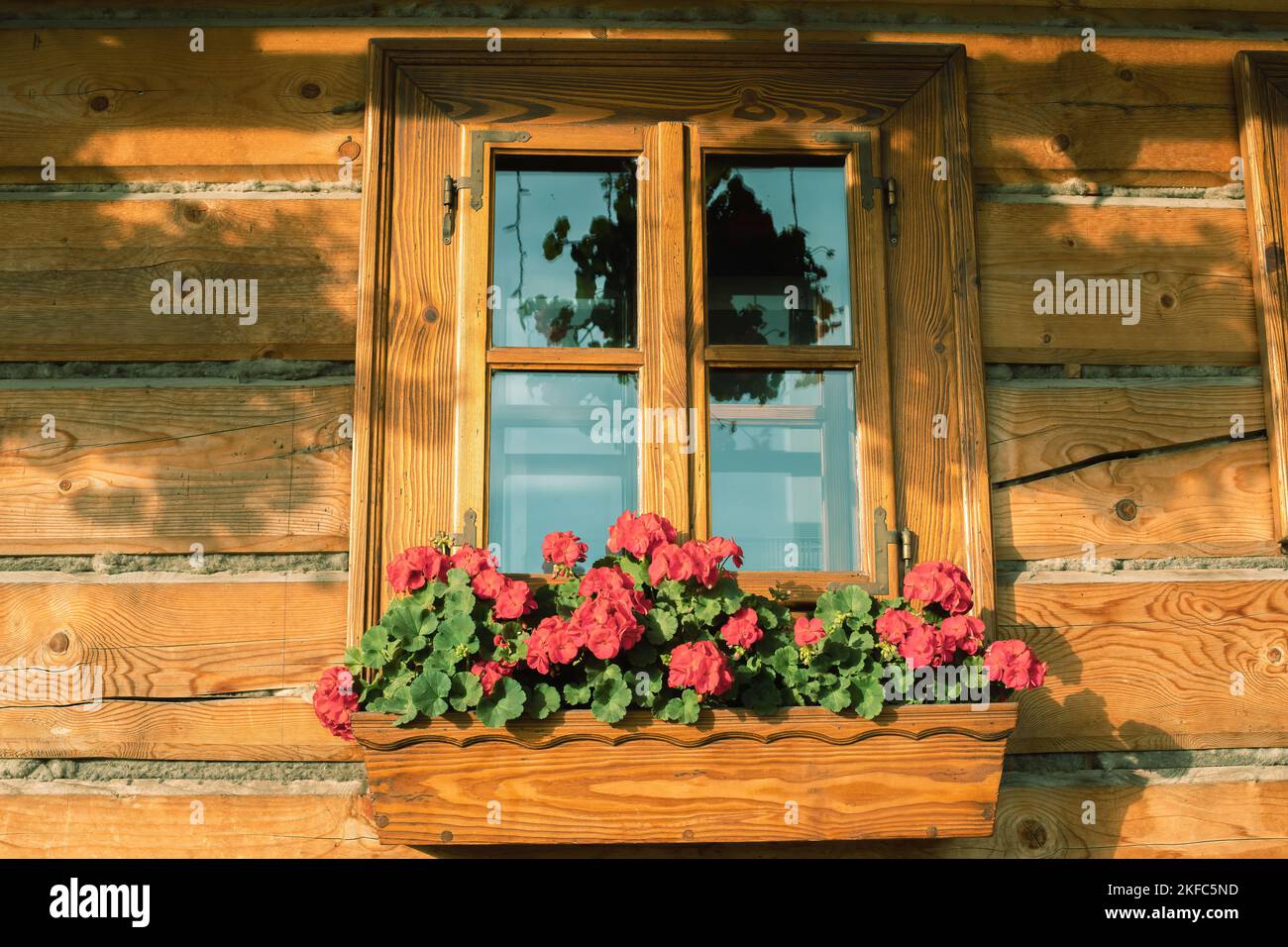 Nicely decorated window of a log cabin house Stock Photo - Alamy