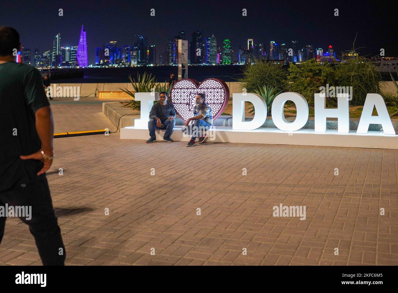 FIFA World Cup Qatar 2022 fans take pictures at a luminous sign on Doha ...