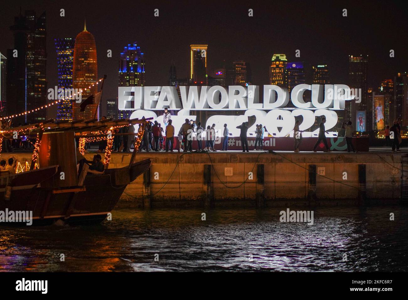 People visit the FIFA World Cup Qatar 2022 sign on Doha's corniche as ...