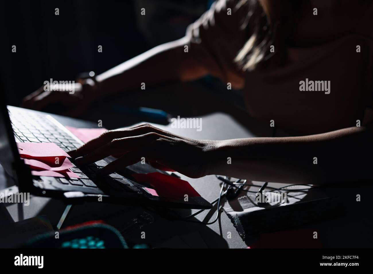 female cyber gamer playing online at night. cyber sport esports concept ...