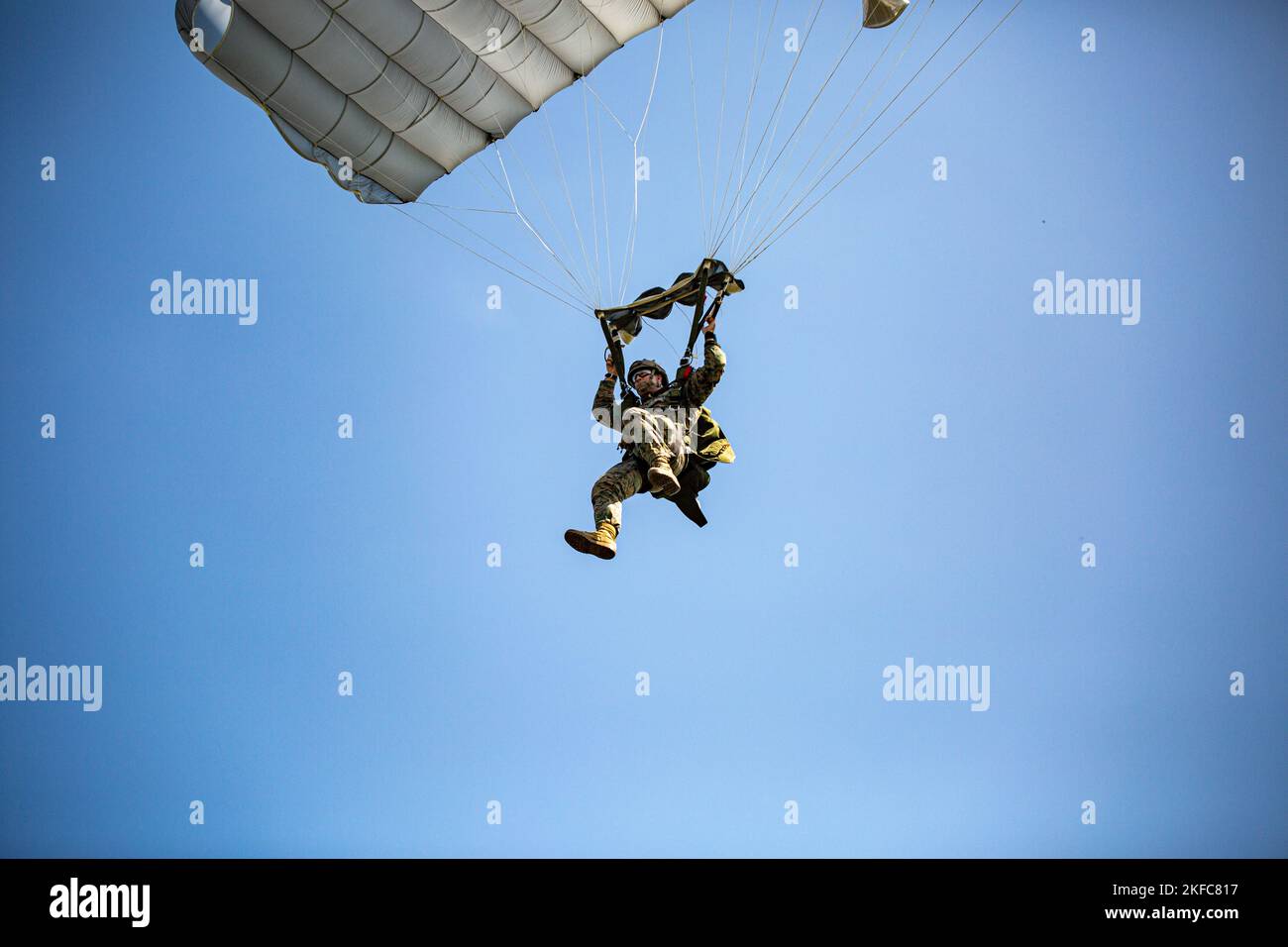 A U.S. Marine with 3rd Force Reconnaissance Battalion glides while ...