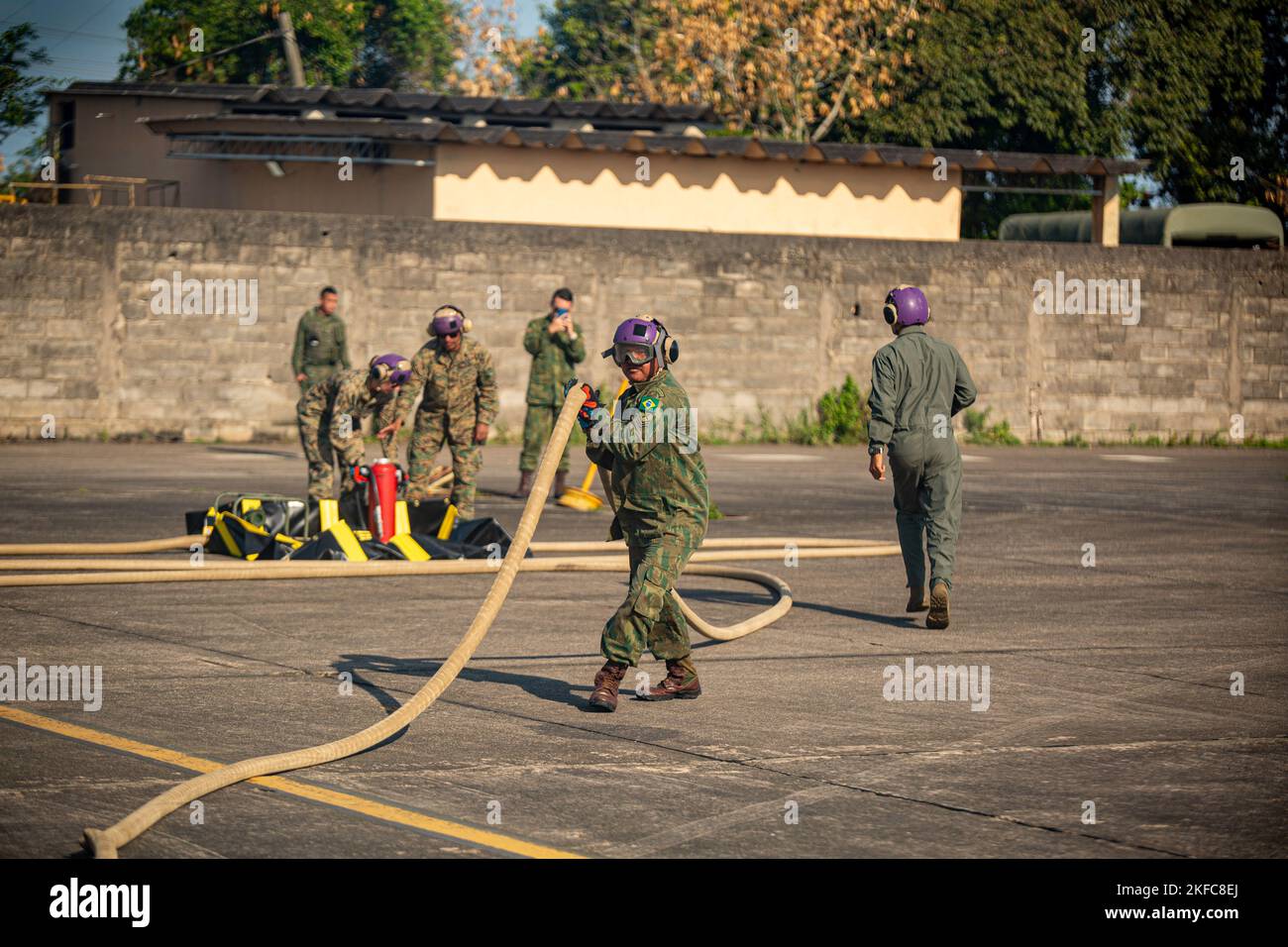A Brazilian Marine assists Marine Wing Support Squadron (MWSS) 772, 4th ...