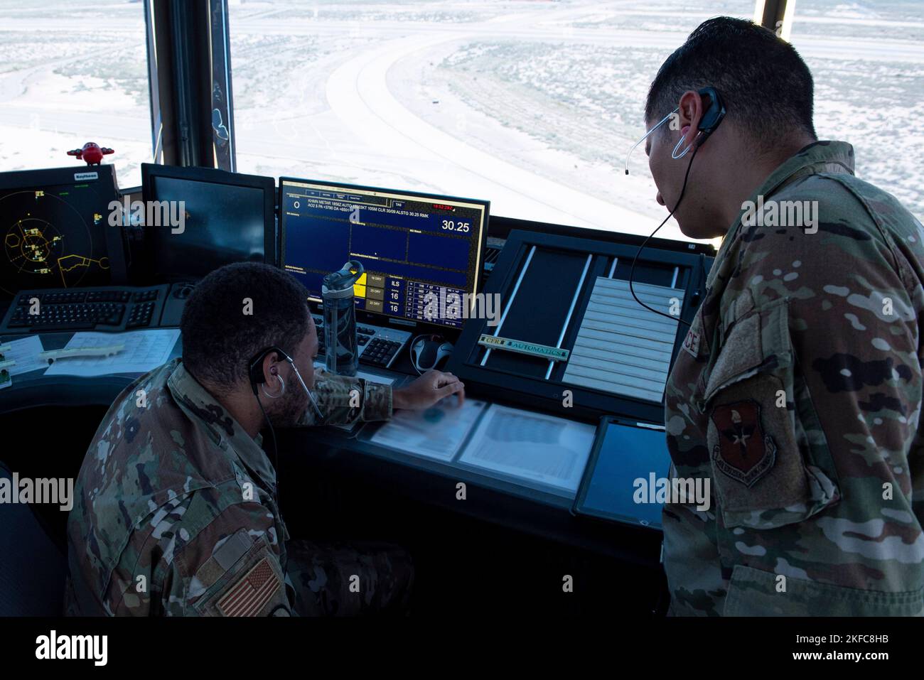 U.S. Air Force Airman 1st Class Ajay Baptiste, left, 54th Operations ...