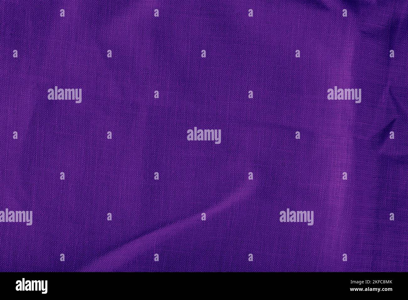 Purple linen fabric. Texture of crumpled linen fabric in folds close-up ...