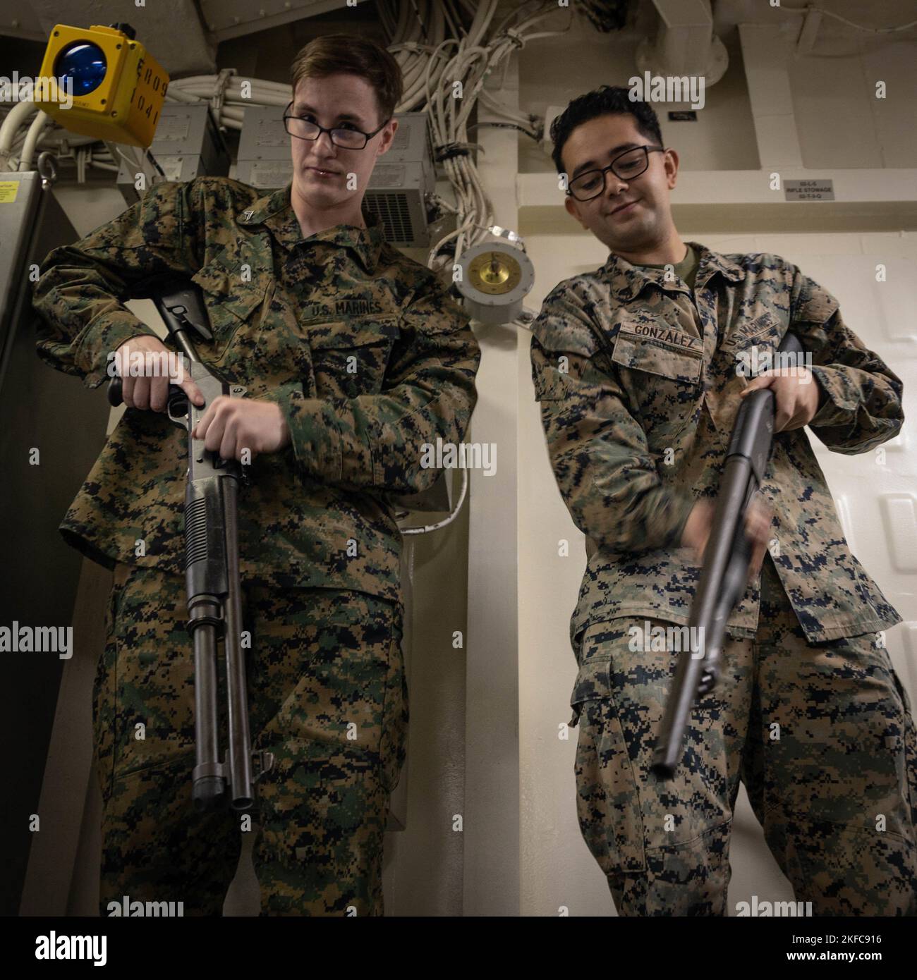 U.S. Marine Corps Cpl. David Taylor, left, a data systems administrator ...