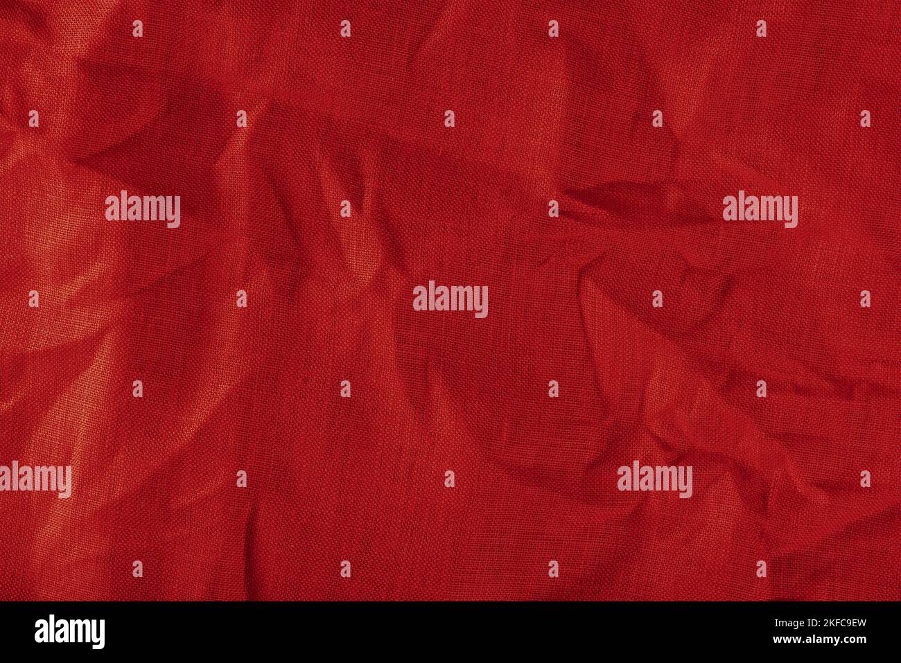 Red linen fabric. Texture of crumpled linen fabric in folds close-up ...