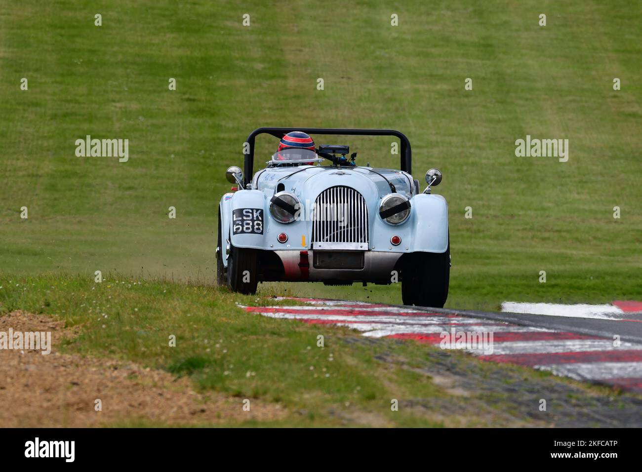 Taking a wide line through the corner, Martin Pratt, Morgan Plus 4 ...