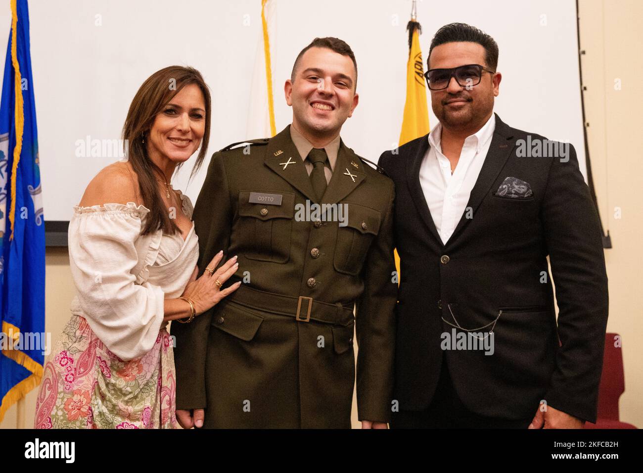 U.S. Army 2nd Lt. Michael Cotto, poses for a picture with his family ...