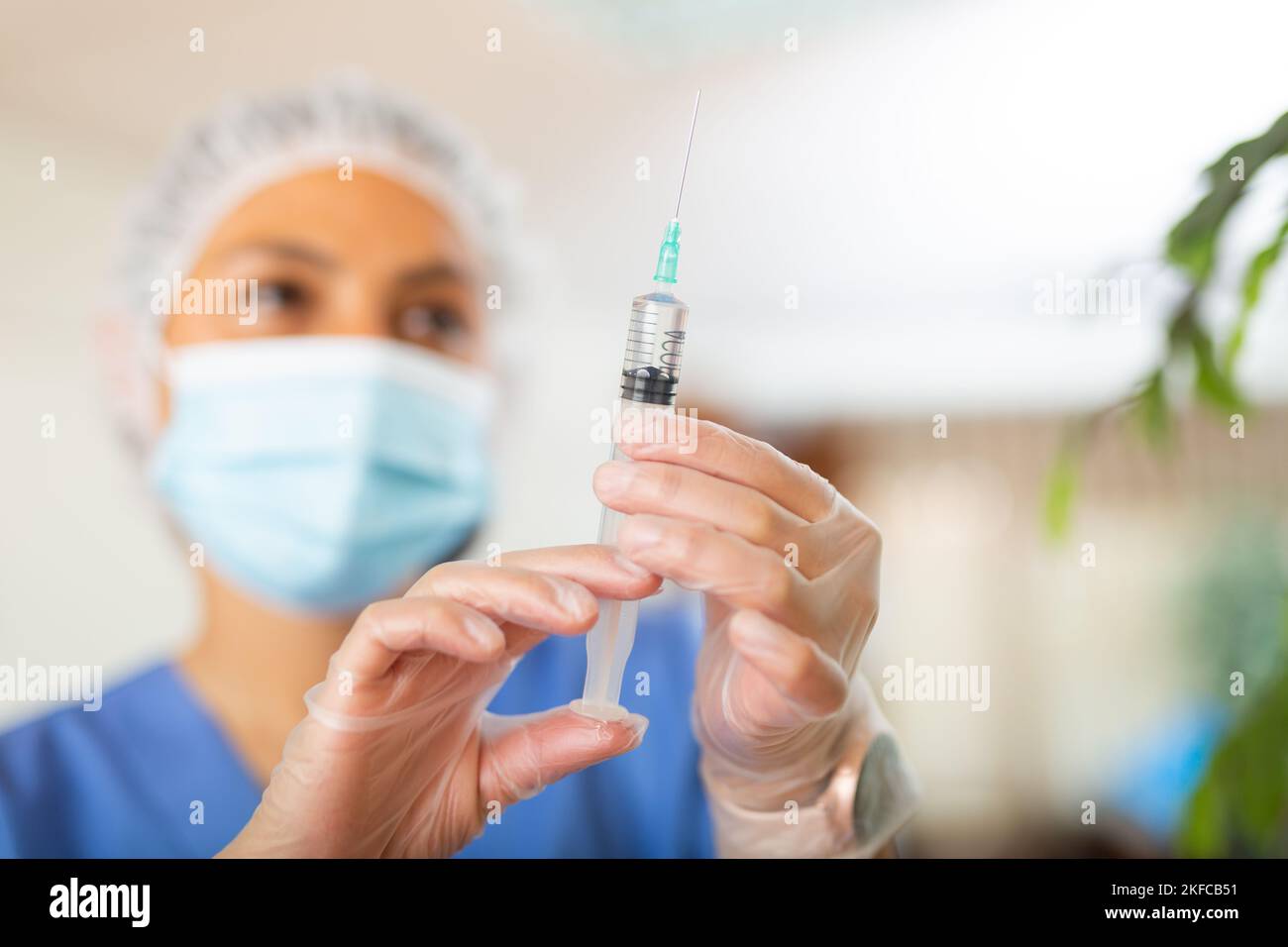 Syringe for injection in medical worker hands Stock Photo - Alamy