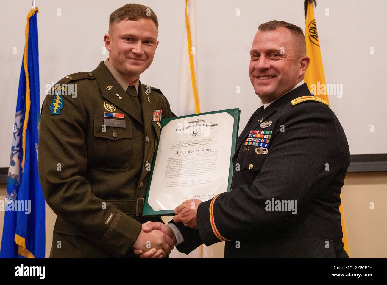 U.S. Army 2nd Lt. David Crowe, left, receives his appointment ...