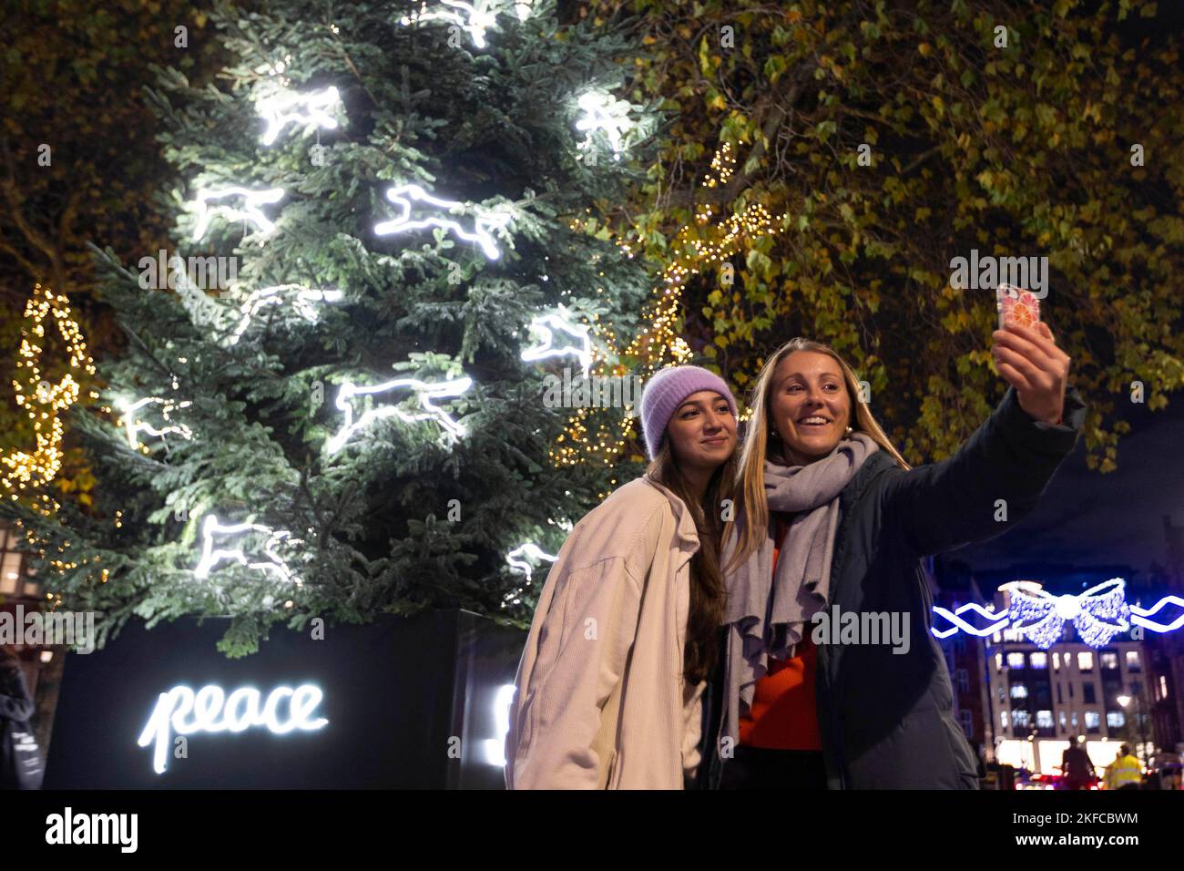 EDITORIAL USE ONLY Members of the public take a selfie with the ...