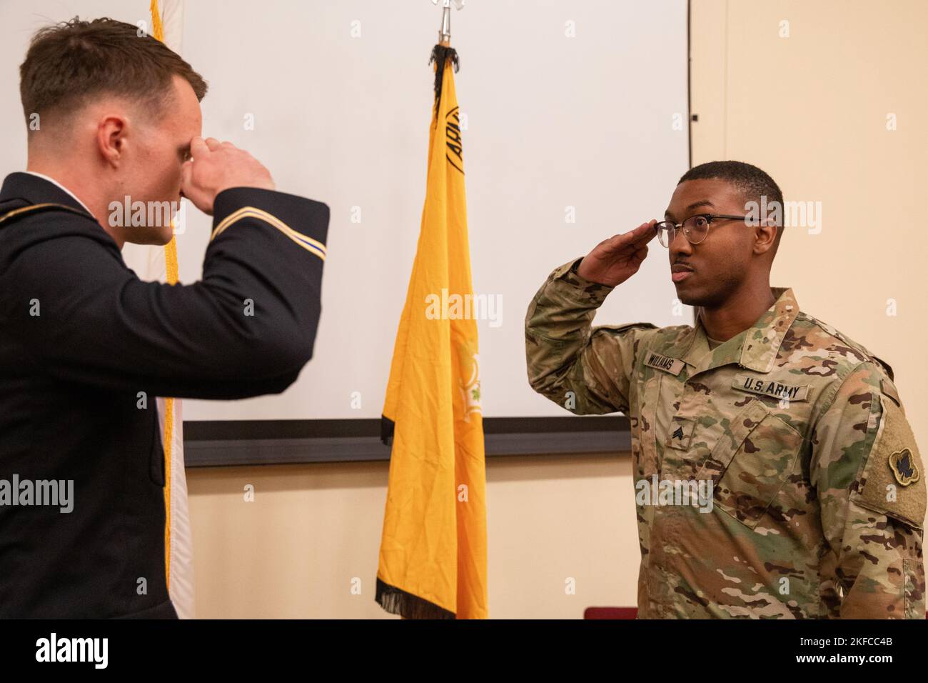 U.S. Army 2nd Lt. Phil Rudak, left, an aviation officer, renders his ...