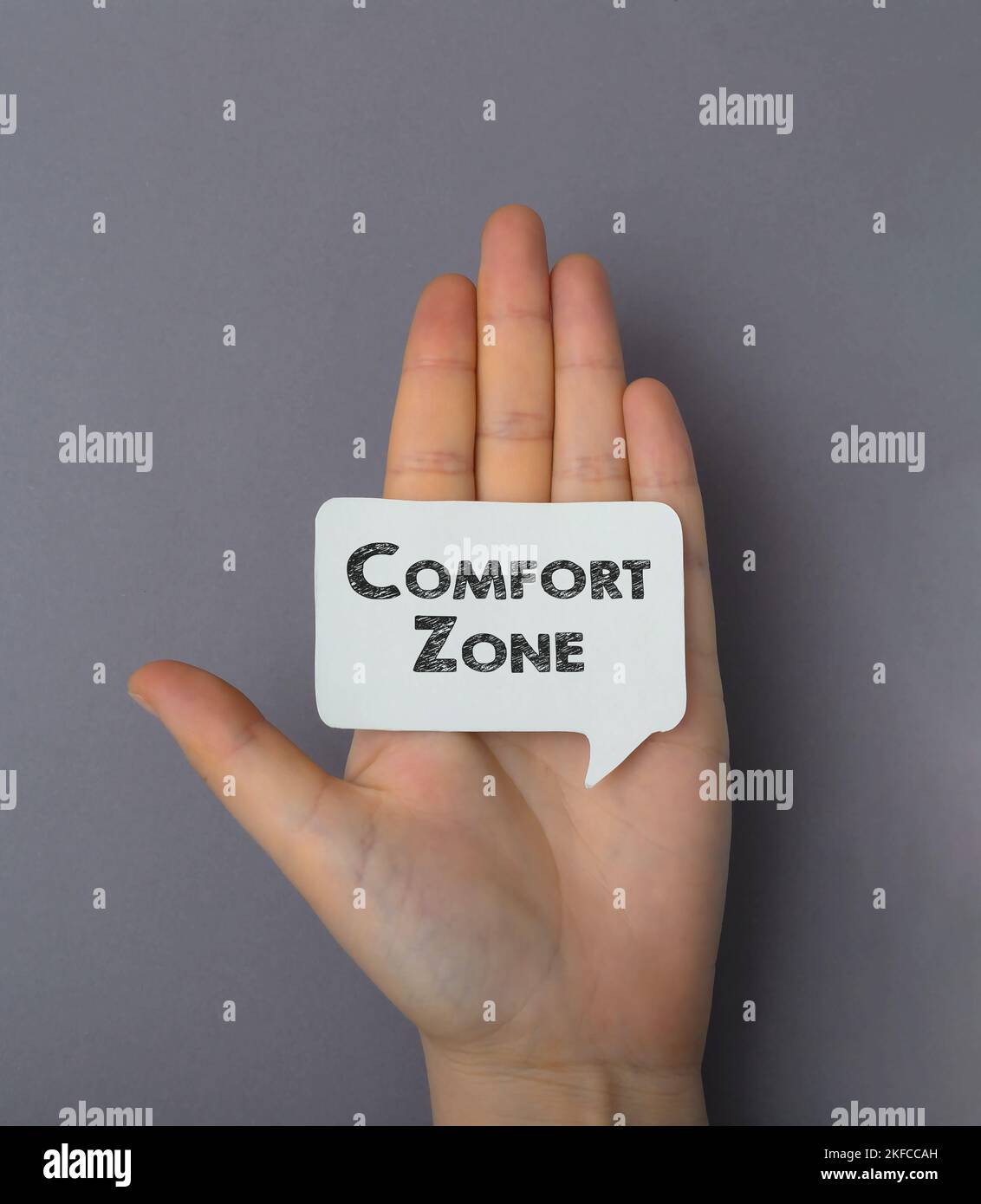 the inscription on the business card comfort zone. The girl is holding ...
