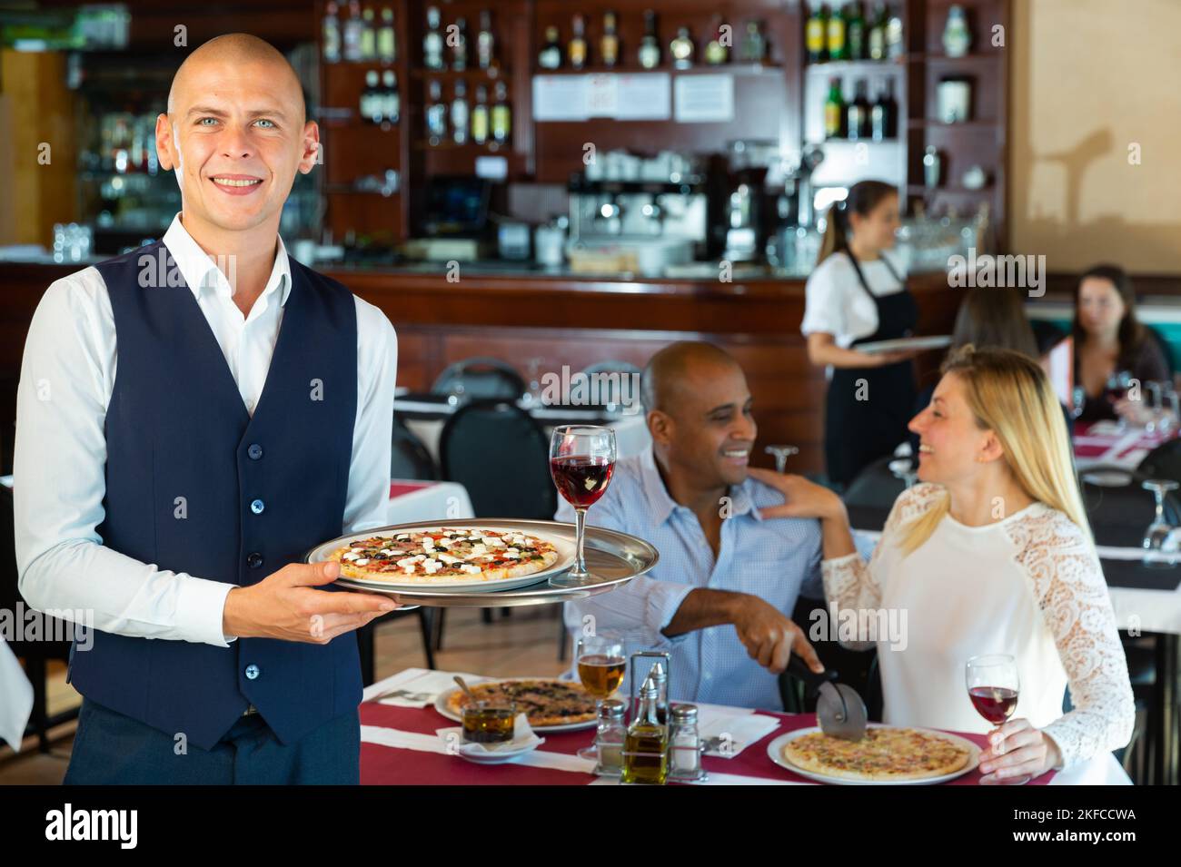 Spanish waiter serving customers hi-res stock photography and images ...