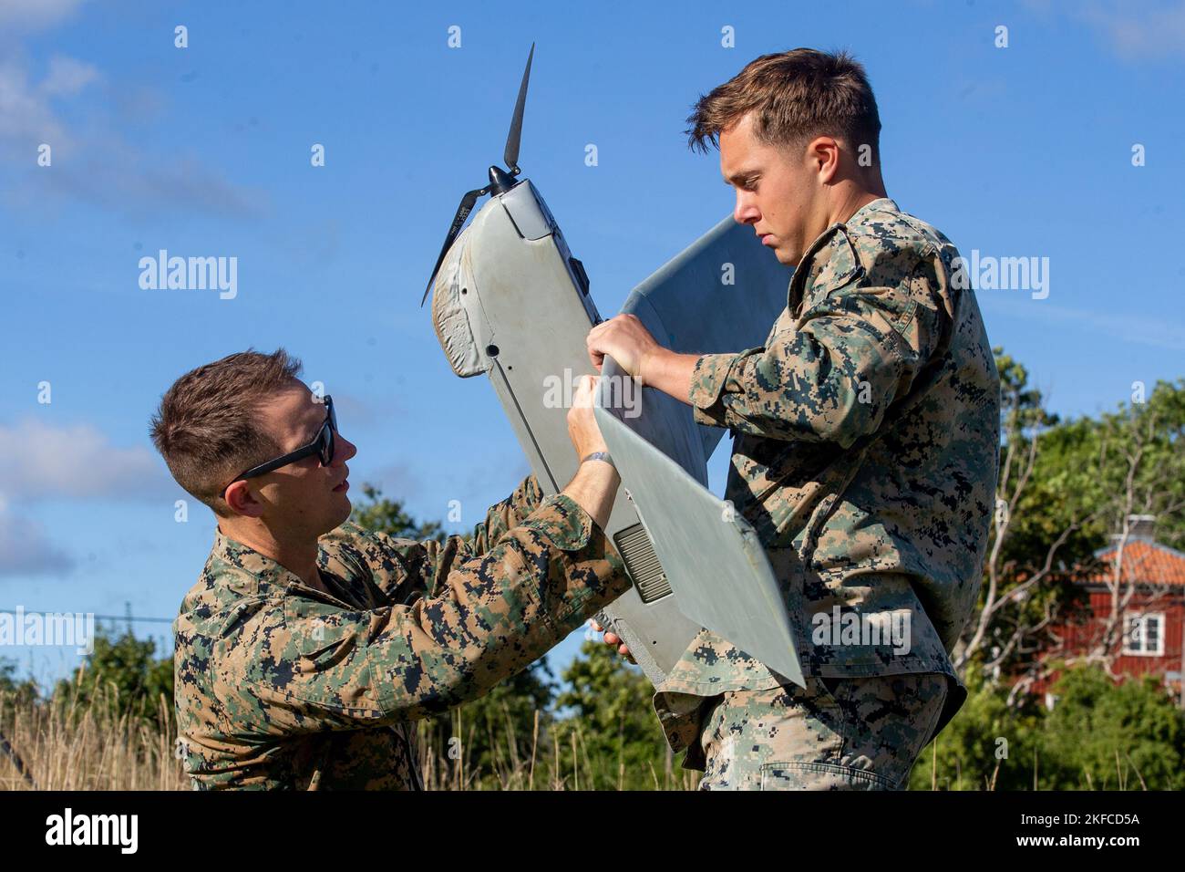 U.S. Marine SSgt. Joseph Owens (left), a light armored vehicle crewman ...
