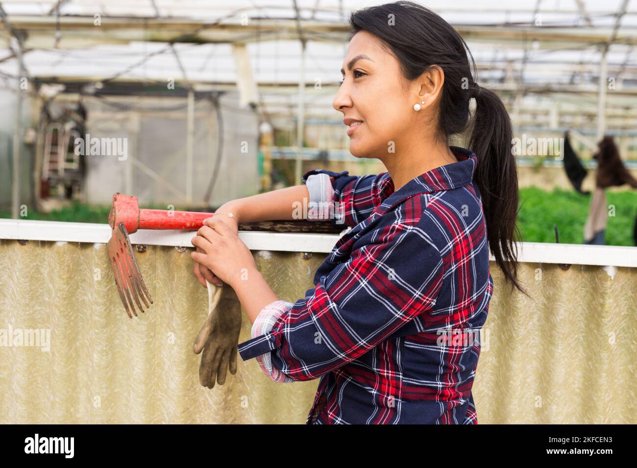 woman gardener worker standing with rake Stock Photo - Alamy