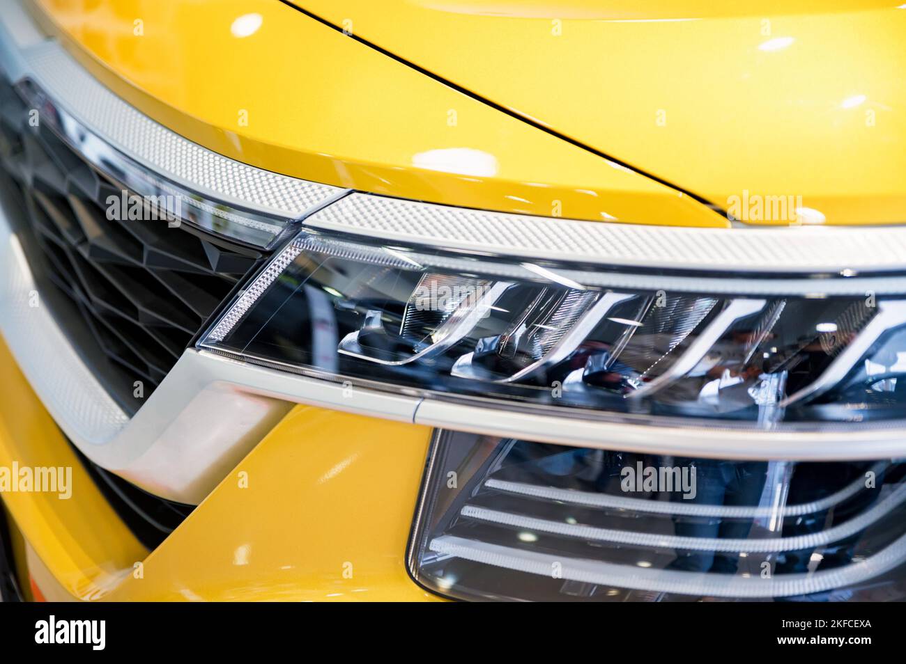 Close-up image of headlights of white modern car Stock Photo - Alamy