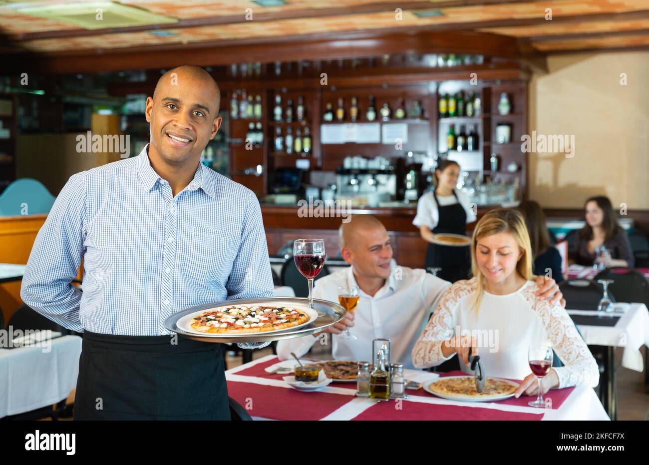 Pizza restaurant waiter hi-res stock photography and images - Alamy