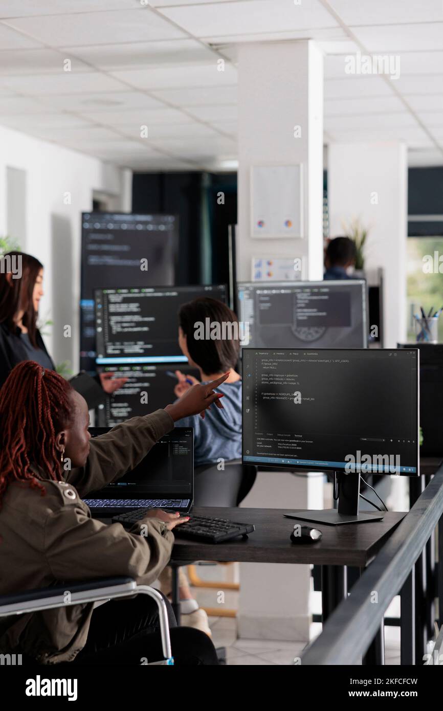 Software programmer with physical disability working on server coding ... Software programmer with physical disability working on server coding ...