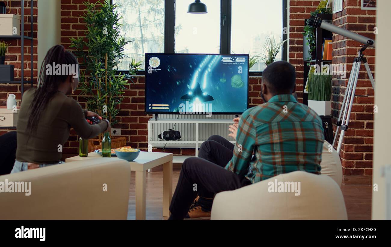 Diverse people having fun with video games challenge, playing online ...