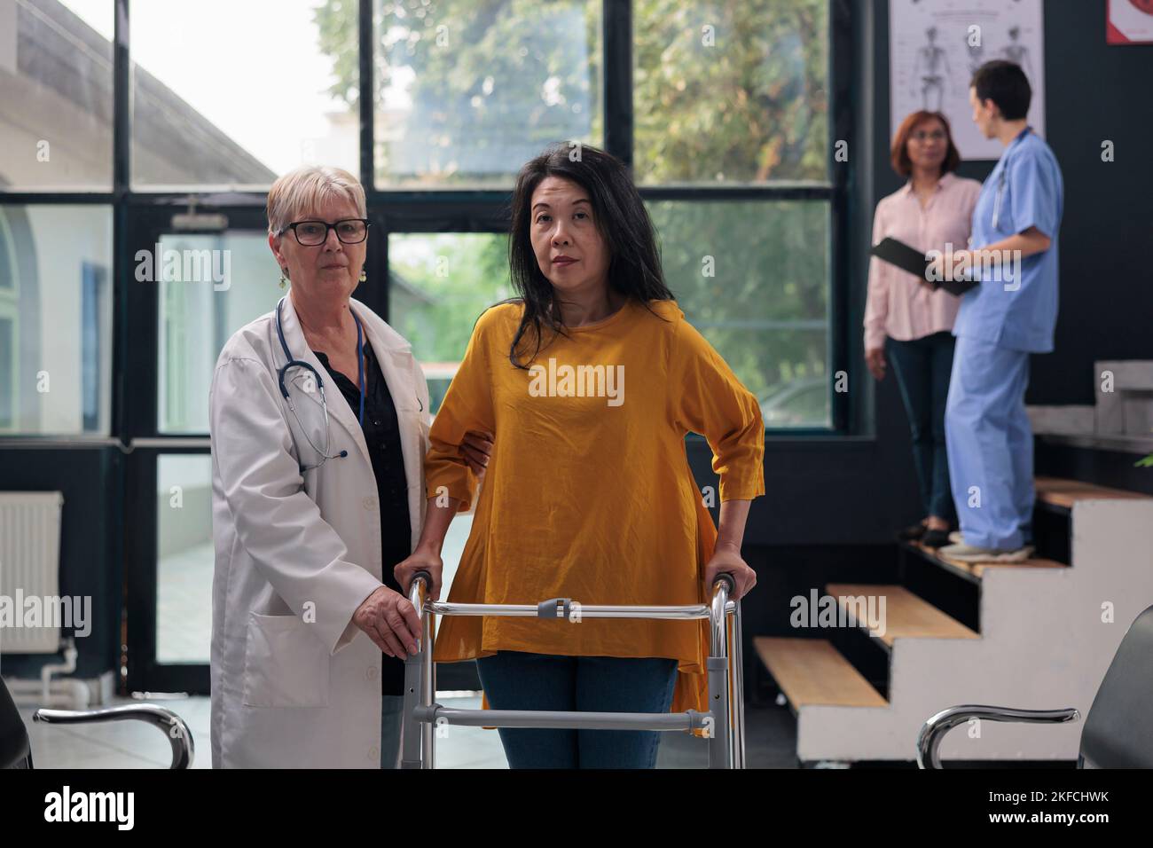 Injured patient with leg injury walking with walk frame and doing ...