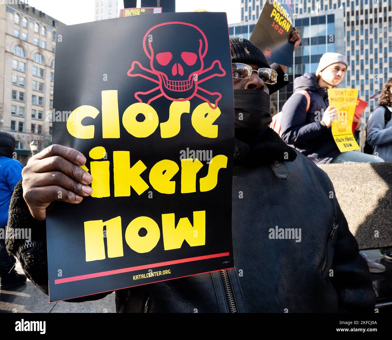 New York, US, 17/11/2022, Person holding a sign saying "Close Rikers ...