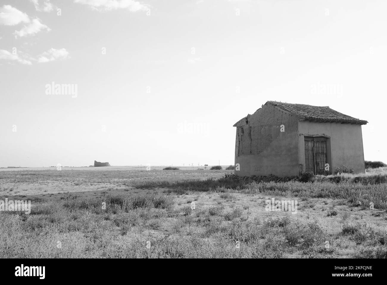 A grayscale view of an empty farmhouse in a Castilian village in Spain ...