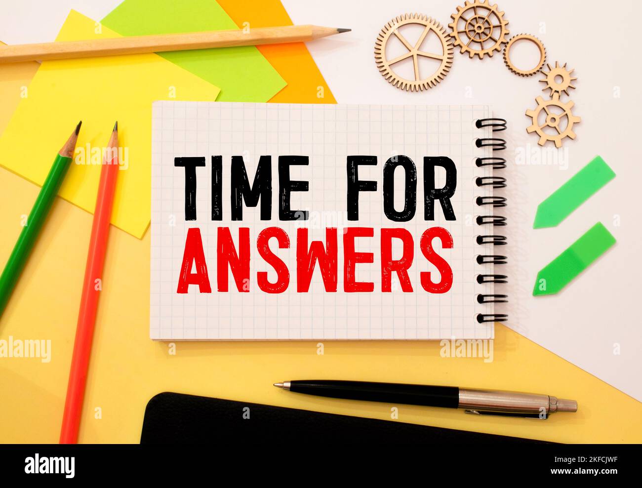 On a pink background, pen and notebook with the text TIME FOR ANSWERS ...