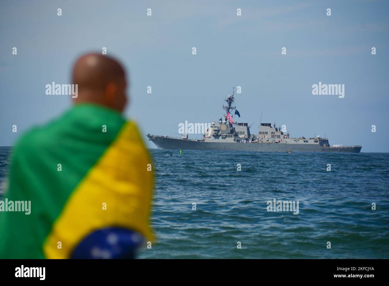 RIO DE JANEIRO (Sept. 7, 2022) A man watches the Arleigh Burke-class ...