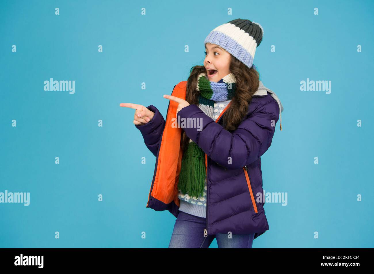 Dont just walk past. Happy girl pointing at something. Little child ...