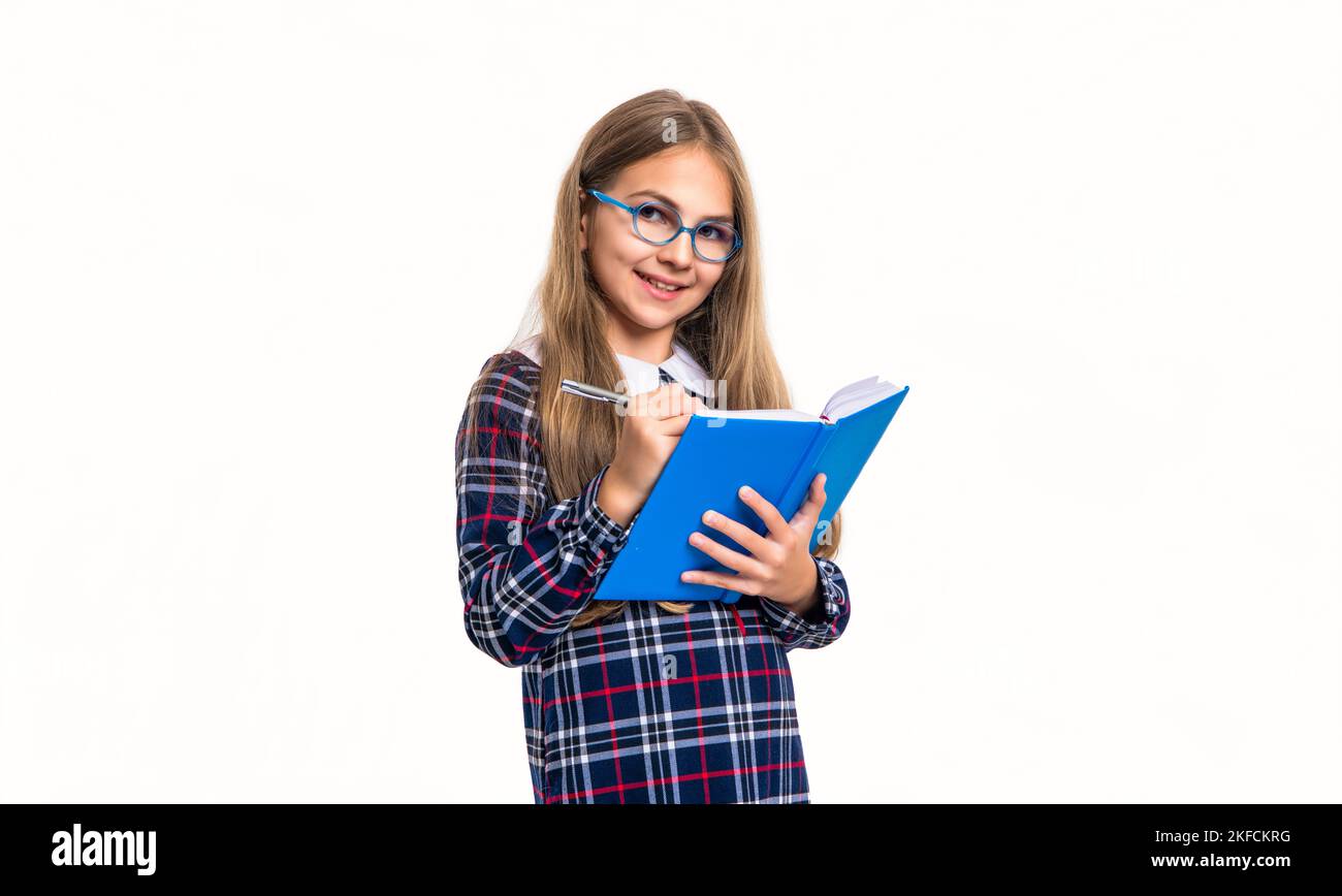 smiling school girl noting notes in studio. school girl noting notes ...