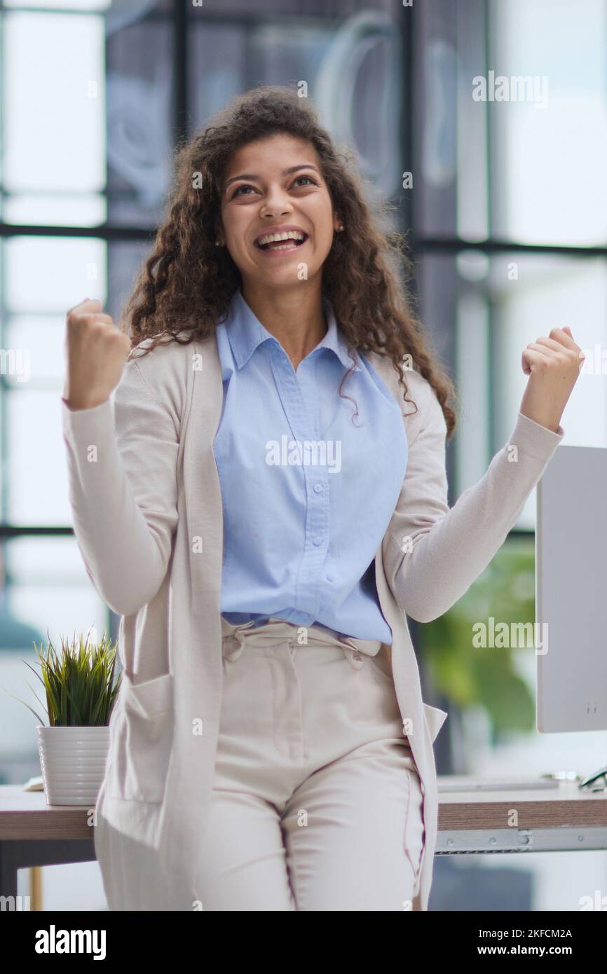 Excited young girl celebrating success business achievement result ...