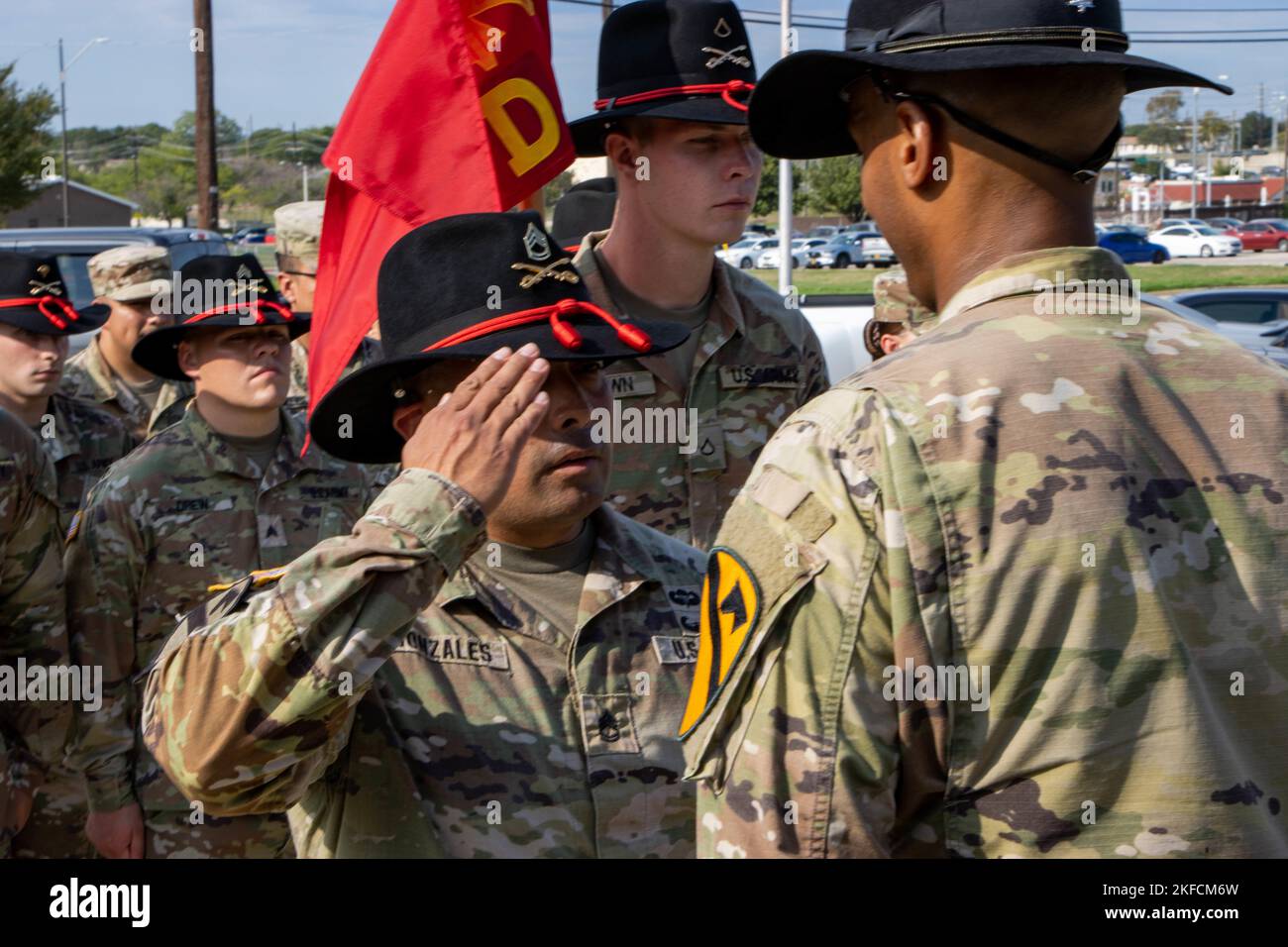 Sgt. 1st Class Aaron Gonzales salutes Cpt. Zemas K. Andargachew during ...