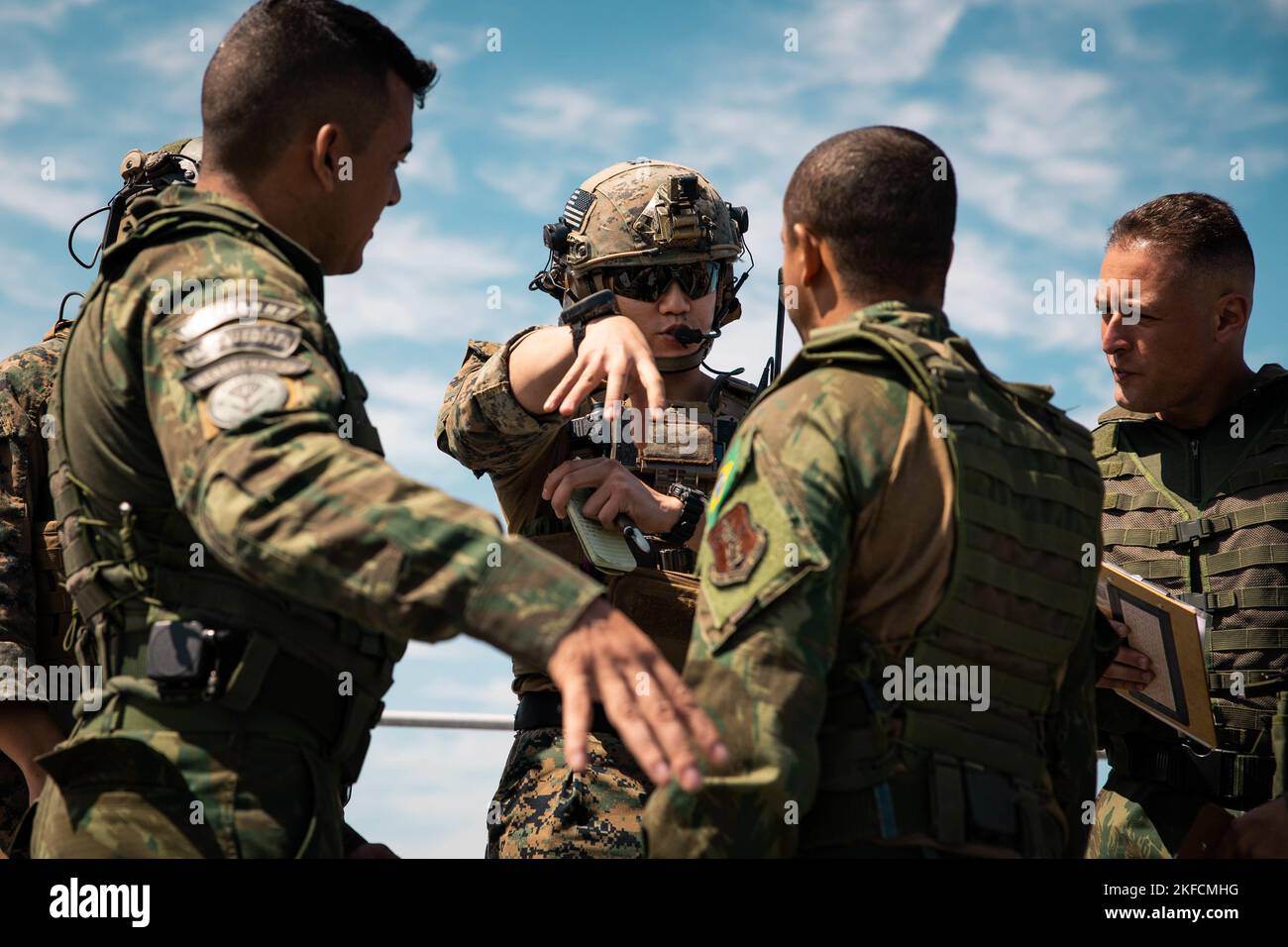U.S. Marine Corps Sgt. Brian Wu, center, a joint terminal attack ...