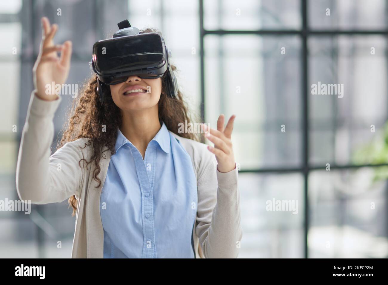 Girl trying to touch objects in virtual reality Stock Photo - Alamy