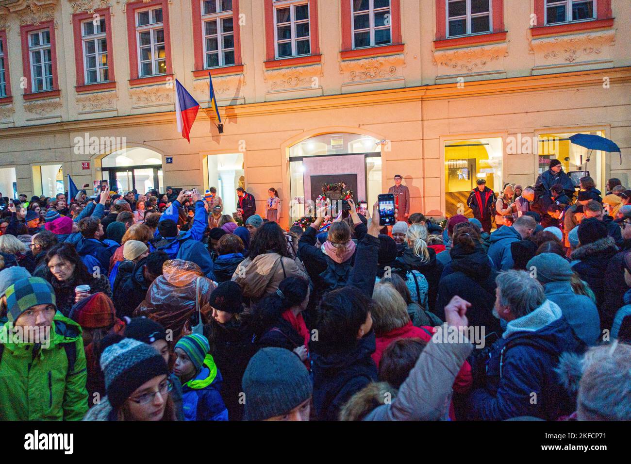 People light candles below the memorial plaque marking the November ...