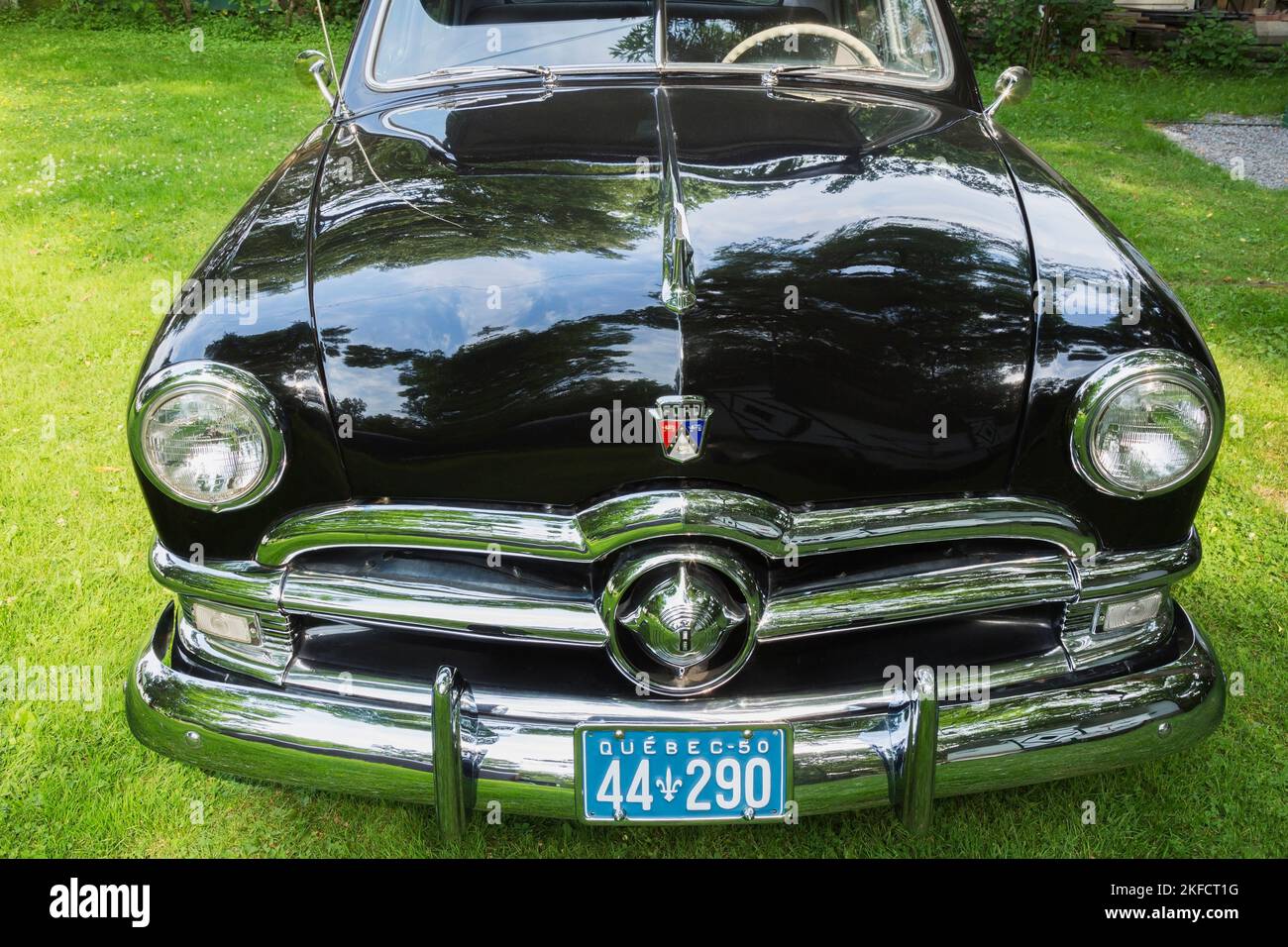 Front end of black 1950 Ford Custom Deluxe with chrome trim automobile ...
