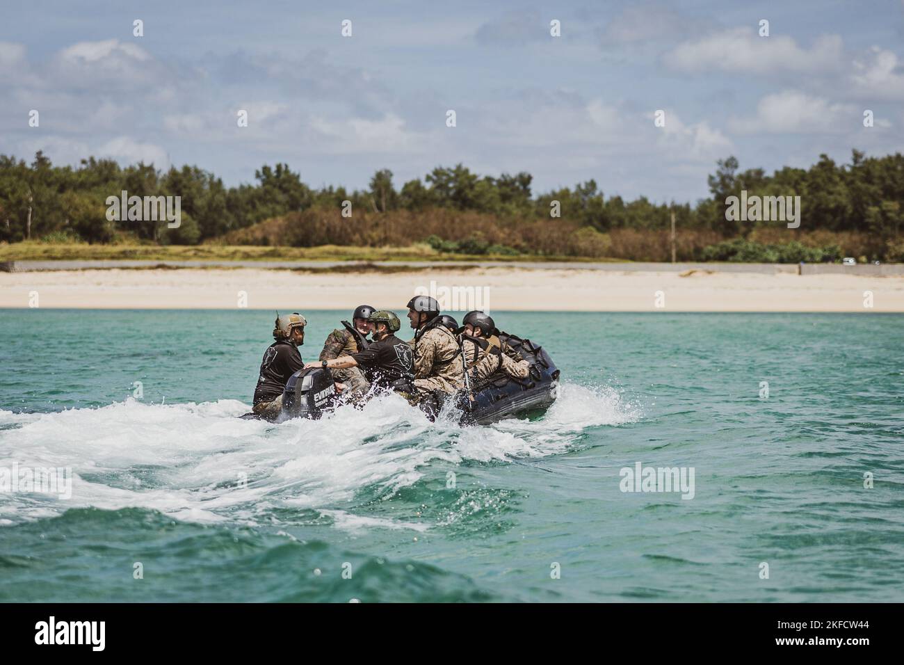 U.S. Marines with III Marine Expeditionary Force (MEF), ride in a ...