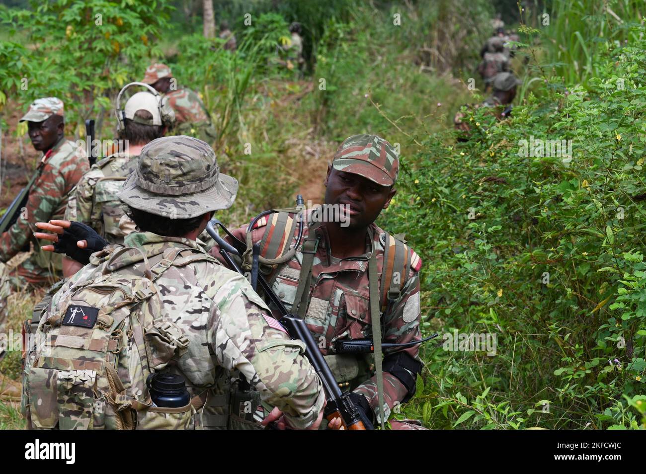A Beninese soldier from the 1st Commando Parachute Battalion and a U.S ...